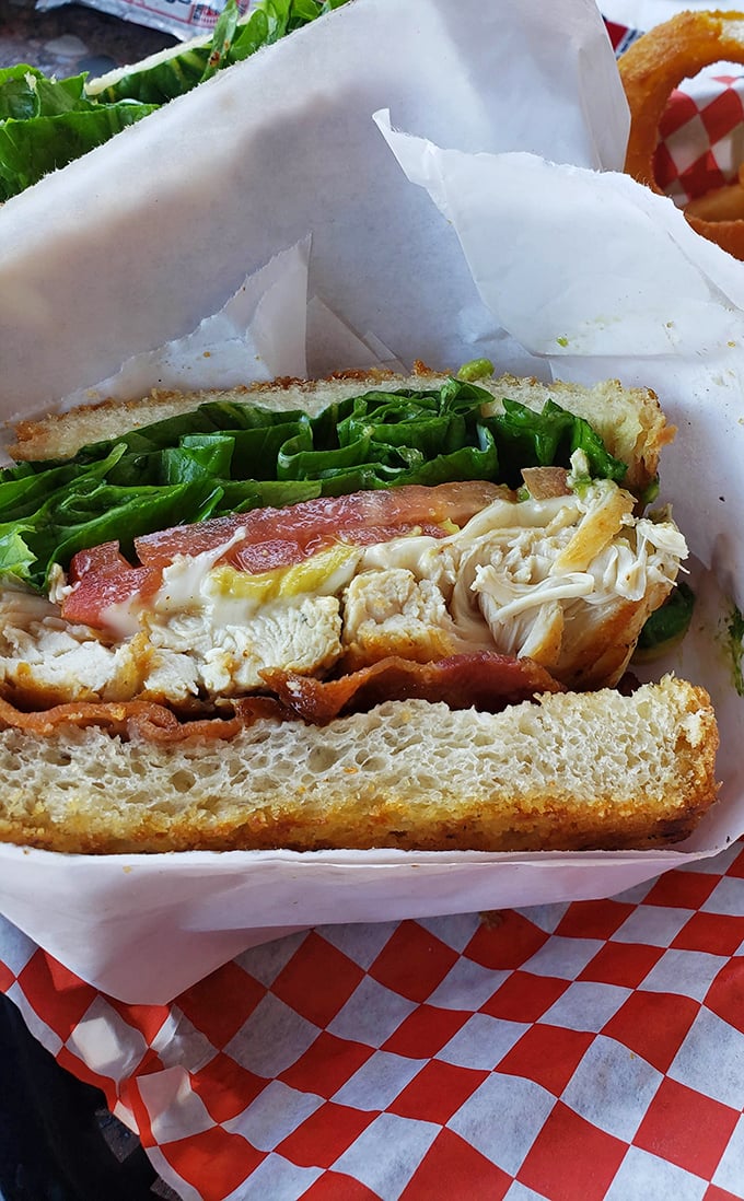 This isn't just a sandwich; it's architectural integrity between bread. Layers of flavor stacked with the precision of a Jenga master who moonlights as a chef.