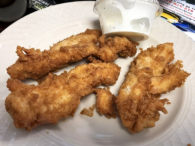 These chicken tenders aren't those sad freezer-to-fryer imposters from chain restaurants. Each bite delivers that crackling exterior giving way to juicy perfection.