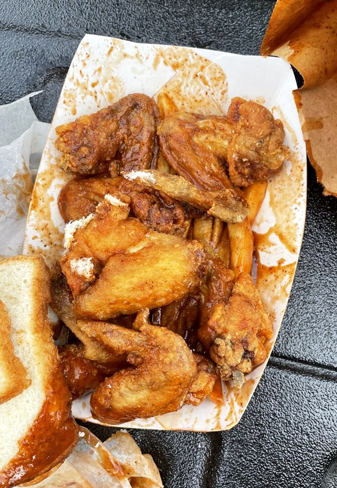 Fried wings nestled among french fries and white bread&mdash;the holy trinity of comfort food that makes Monday feel like Saturday.