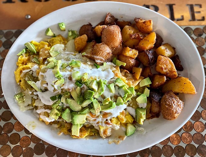 Chilaquiles that would make your abuela proud &ndash; crispy yet tender tortillas swimming in sauce, crowned with avocado and a drizzle of crema.