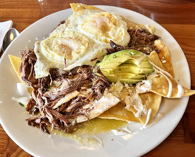 Breakfast reimagined: shredded meat, crispy tortillas, perfectly fried eggs, and avocado&mdash;a morning fiesta that makes waking up worthwhile.