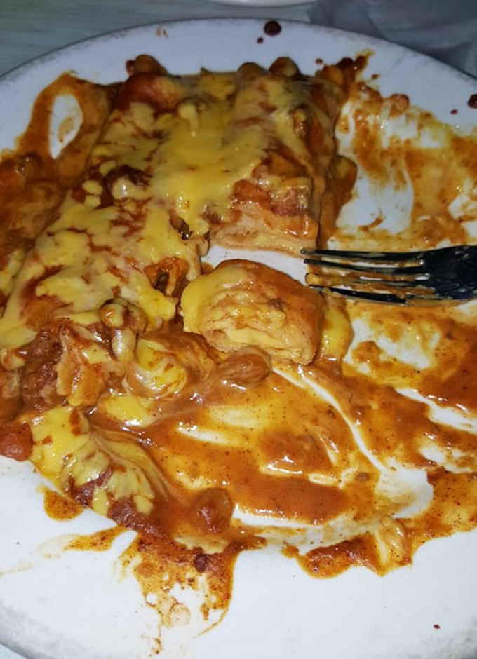 This isn't just melted cheese&mdash;it's an edible history lesson. The chile con carne sauce blankets these enchiladas like a warm Texas hug.