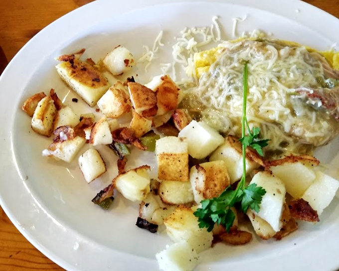 This omelet doesn't just contain chili verde, it celebrates it, with perfectly cooked potatoes standing by as willing accomplices.