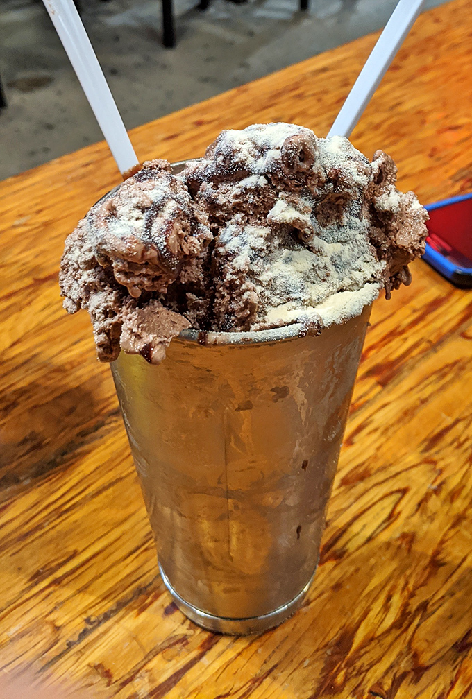 This isn't just a chocolate shake&mdash;it's a structural engineering marvel topped with enough chocolate to make Willy Wonka jealous.