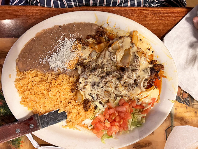 When cheese meets perfectly seasoned meat, magic happens. The rice and beans aren't sidekicks&mdash;they're essential supporting characters.