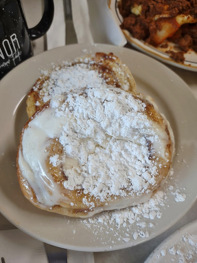 Behold the cinnamon roll that ate Cleveland – grilled to perfection and dressed in cream cheese frosting like Sunday best.