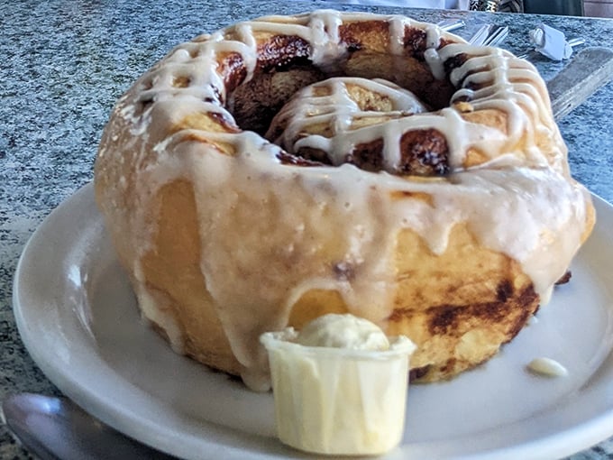 The legendary half-pound cinnamon roll that's less dessert and more architectural achievement. That cream cheese frosting should be illegal in seven states.