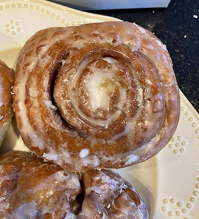 This cinnamon roll isn't just a pastry, it's an architectural marvel. Layers of dough and glaze creating a spiral galaxy of sweetness that's worth every calorie.