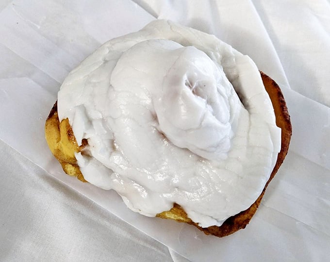 This cinnamon roll could double as a pillow, if pillows were made of pure happiness and covered in heavenly icing.