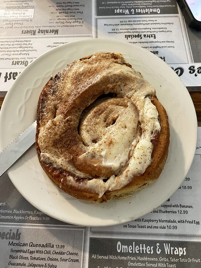 This cinnamon roll isn't just breakfast&mdash;it's an event. Swirled perfection with cream cheese icing that would make even your strictest nutritionist whisper, "Go for it."