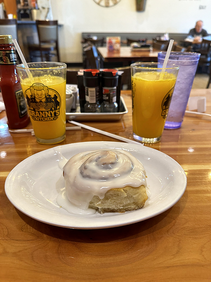 This cinnamon roll isn't just breakfast—it's dessert masquerading as a morning meal, with icing that doesn't know when to quit.