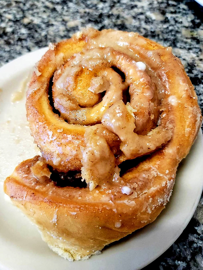 This cinnamon roll isn't just breakfast; it's an event. The glaze melts into every nook and cranny like it was destined to be there.