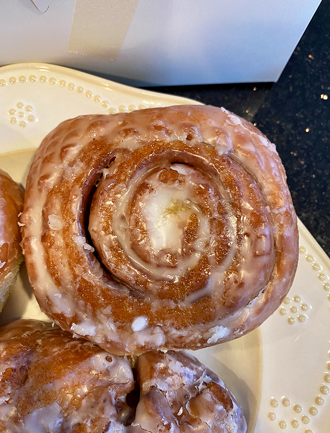 The perfect cinnamon roll doesn't exi— Oh wait, here it is! Swirls of cinnamon and glaze creating a hypnotic pattern that whispers, "Resistance is futile."