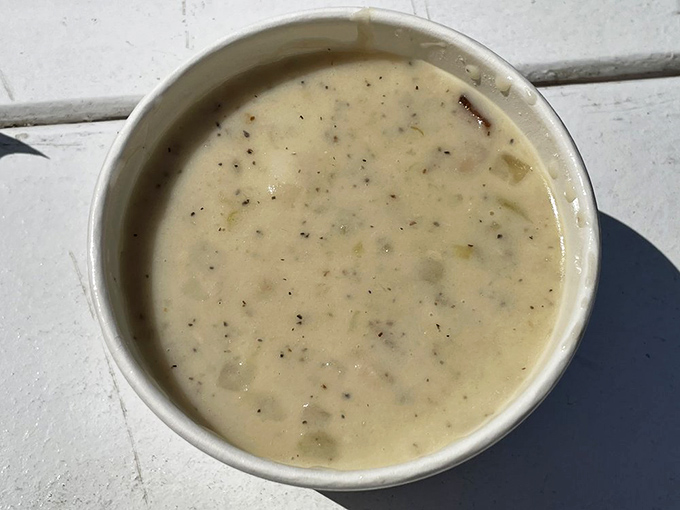 This clam chowder isn't just soup; it's a creamy hug in a bowl, studded with tender clams and subtle seasoning that would make a New Englander nod in respectful approval.