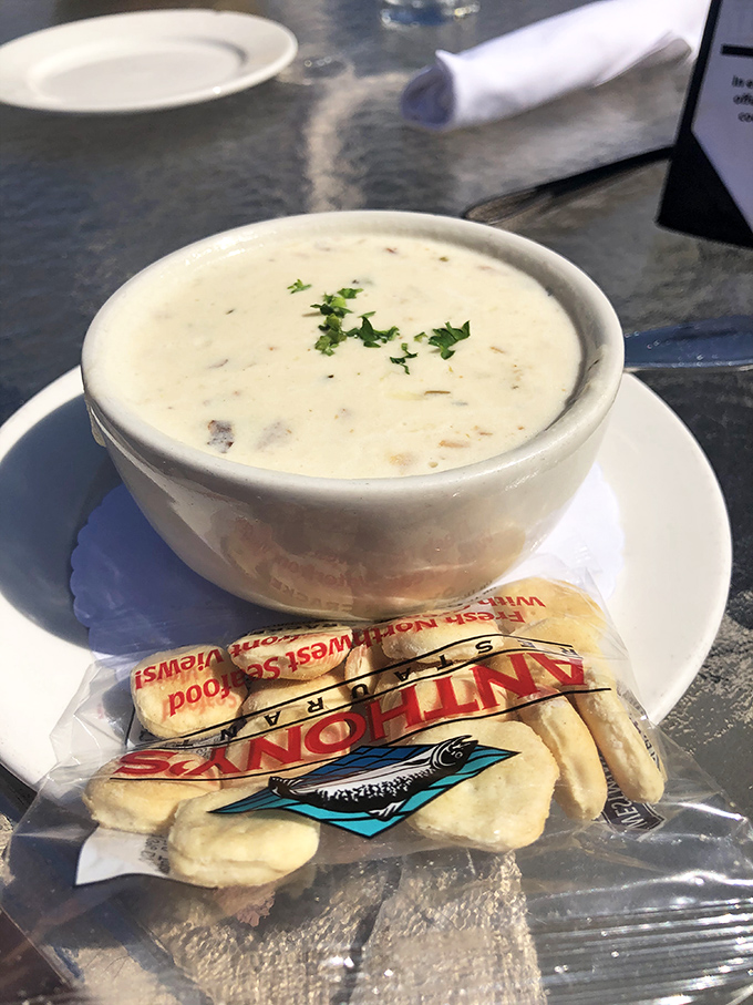 Clam chowder so creamy it should come with a warning label. Those oyster crackers aren't garnish—they're little boats sailing on a sea of deliciousness.