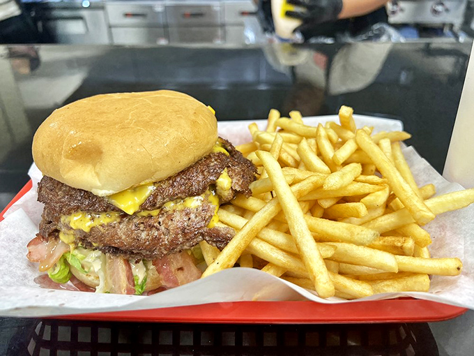 This isn't just a burger with fries&mdash;it's edible architecture where every layer plays its part perfectly.