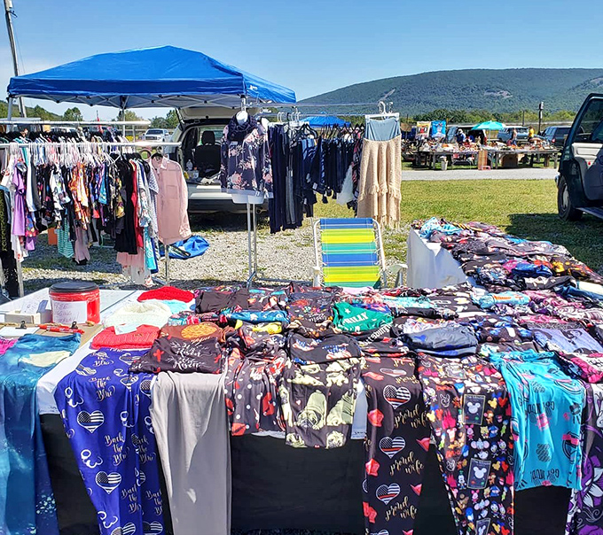 Under the blue Pennsylvania sky, colorful fabrics flutter like flags, signaling bargain hunters to another fashion outpost.