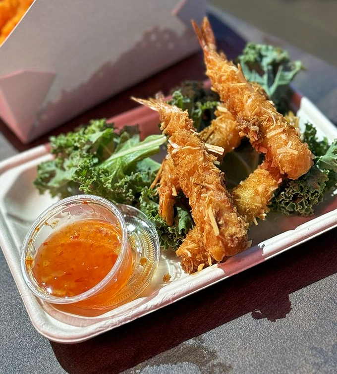 Golden-fried coconut shrimp that crunch like the soundtrack of vacation memories &ndash; dipping sauce included.