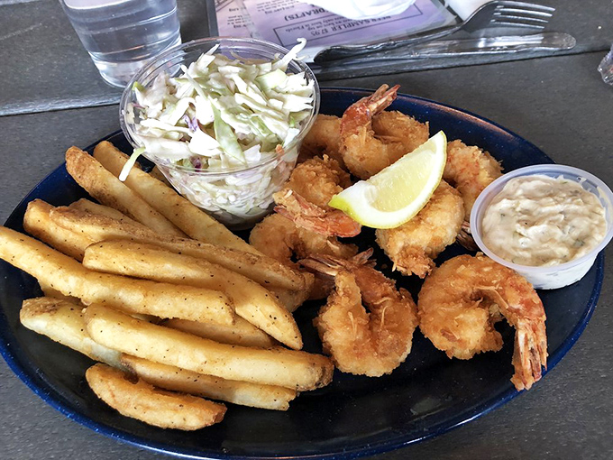 These golden orbs arrive like edible jewelry, each coconut-crusted shrimp a small masterpiece of crunch.