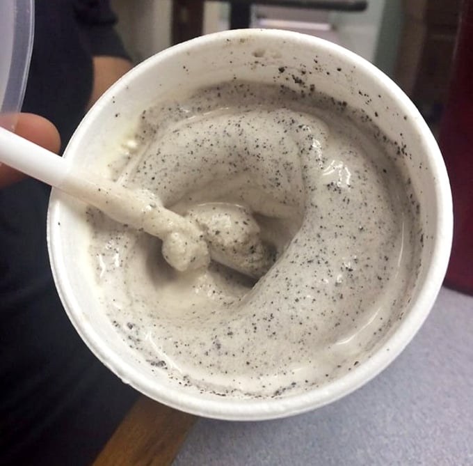 This cookies and cream milkshake isn't just a drink &ndash; it's a spoonable, straw-defying monument to dairy perfection with specks of cookie goodness.