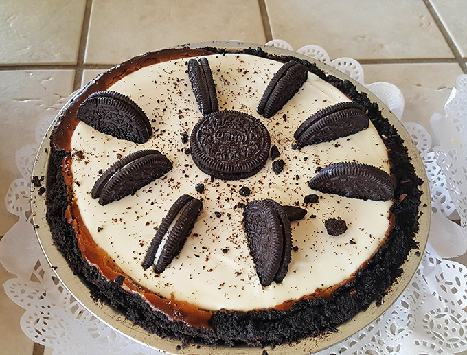 The Cookies & Cream cheesecake arranges Oreos like a crown jewel display, proving that sometimes playing with your food leads to masterpieces.