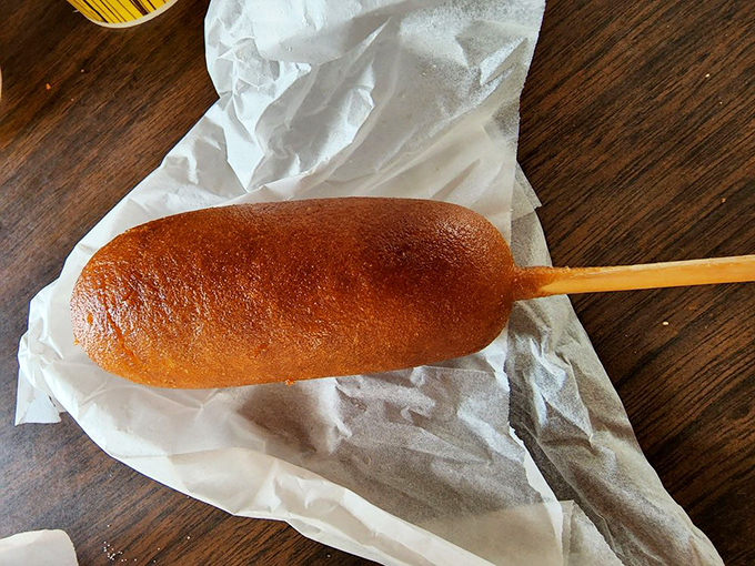 Not just any corn dog, but a hand-dipped marvel on a stick—proof that simple pleasures are often the most profound.