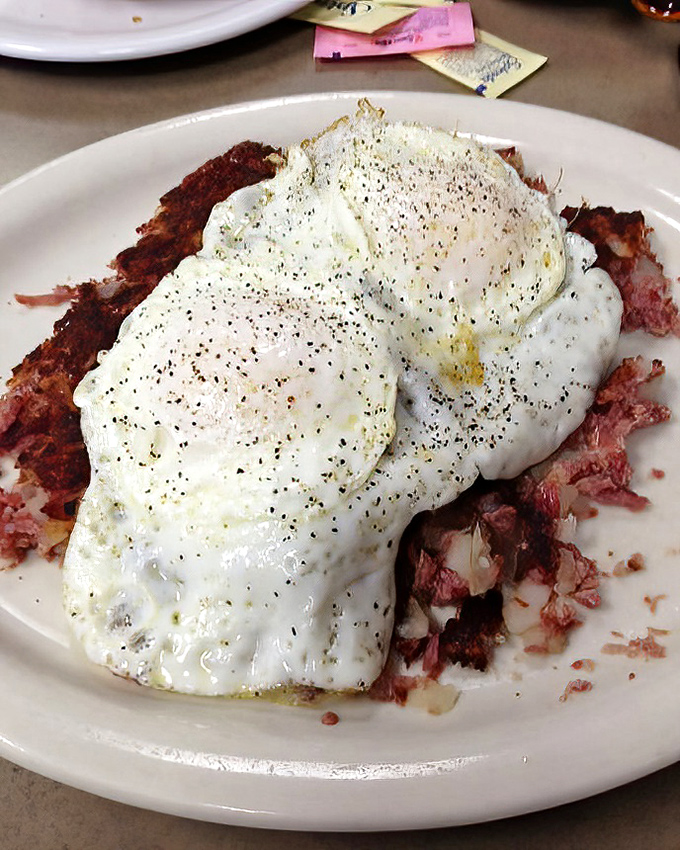 Corned beef hash that would make your cardiologist wince and your taste buds sing. Those eggs on top aren't a garnish&mdash;they're the perfect silky crown.