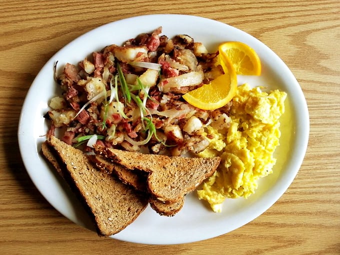 Corned beef hash that doesn't come from a can &ndash; chunky potatoes, savory meat, and eggs sunny enough to brighten even an Oregon rainy day.