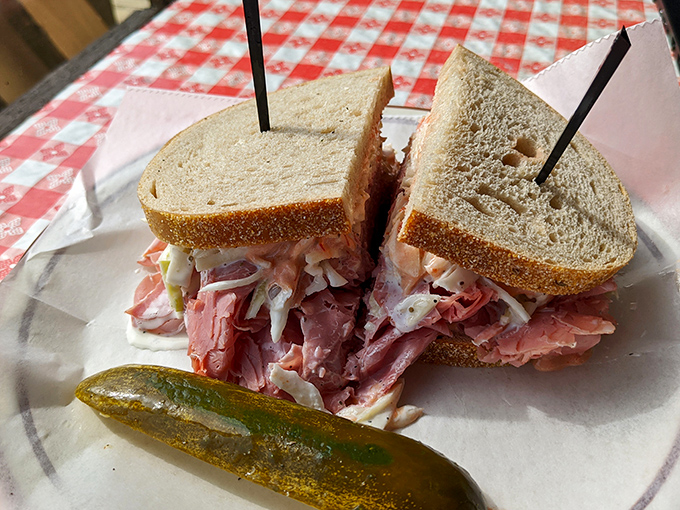 The corned beef sandwich comes with a pickle that isn't just a garnish – it's the exclamation point at the end of a meaty declaration of deliciousness.