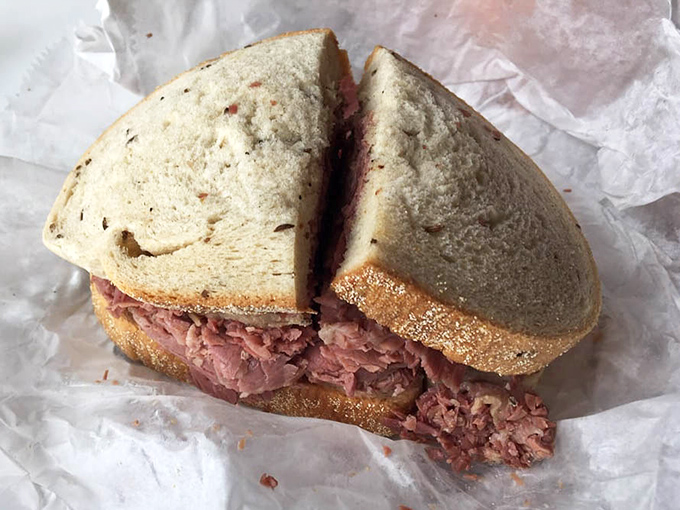 Behold the corned beef in all its pink, piled-high glory&mdash;a sandwich that demands both hands and possibly a nap afterward.