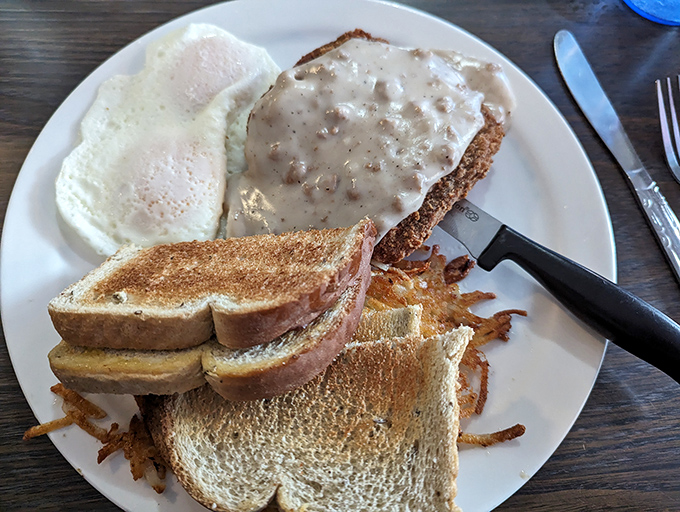 Country fried steak with eggs and toast&mdash;the breakfast of champions who plan on taking a well-deserved nap immediately afterward.