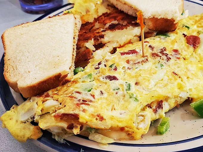 Breakfast perfection on a plate. This omelet doesn't just contain ingredients&mdash;it showcases them, with each bite delivering a perfect balance of flavors alongside golden toast.