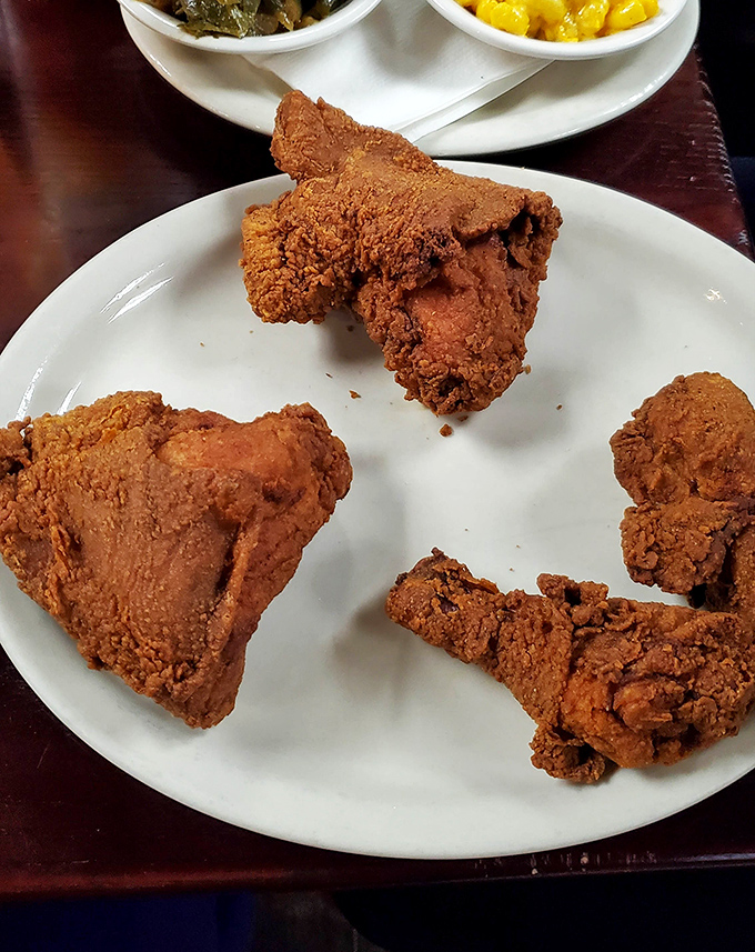 Fried chicken that would make Colonel Sanders weep with jealousy – golden, crispy armor protecting juicy treasure within.