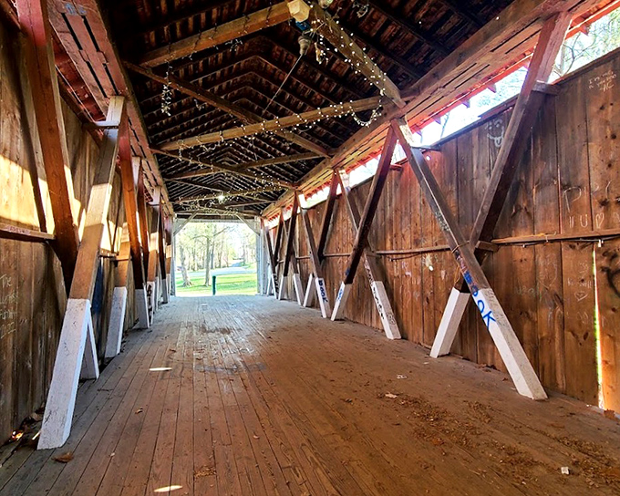 Step into a postcard from yesteryear inside this classic covered bridge, where the wooden beams have witnessed countless whispered secrets and marriage proposals.