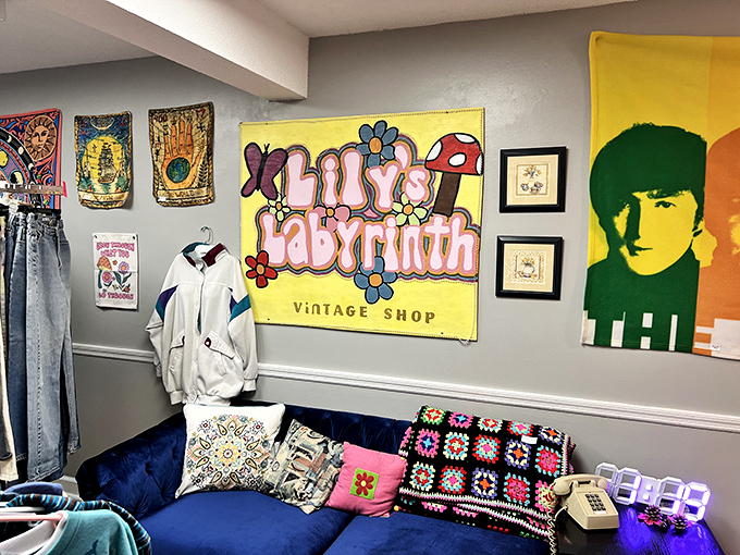 A cozy blue velvet couch invites shoppers to rest between discoveries. That Beatles-inspired artwork would make any Fab Four fan swoon.