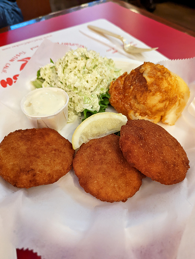 Crab cakes that actually taste like crab? Revolutionary! Golden-brown discs of seafood integrity with just enough binding to keep them decent.