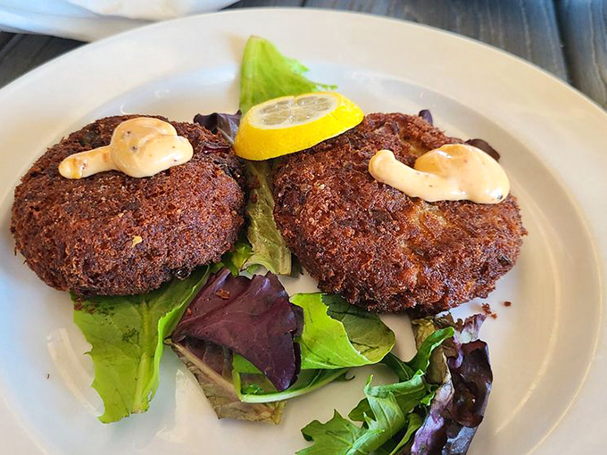 Crab cakes that don't skimp on the good stuff. These beauties are all crab business up front, remoulade party in the back.