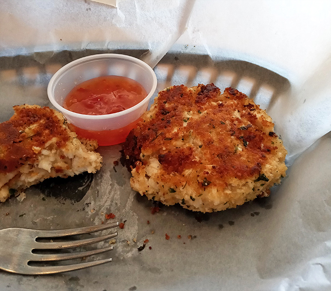 These golden crab cakes aren't just fried, they're a crispy-edged commitment to seafood done right, served with a side of nostalgia.