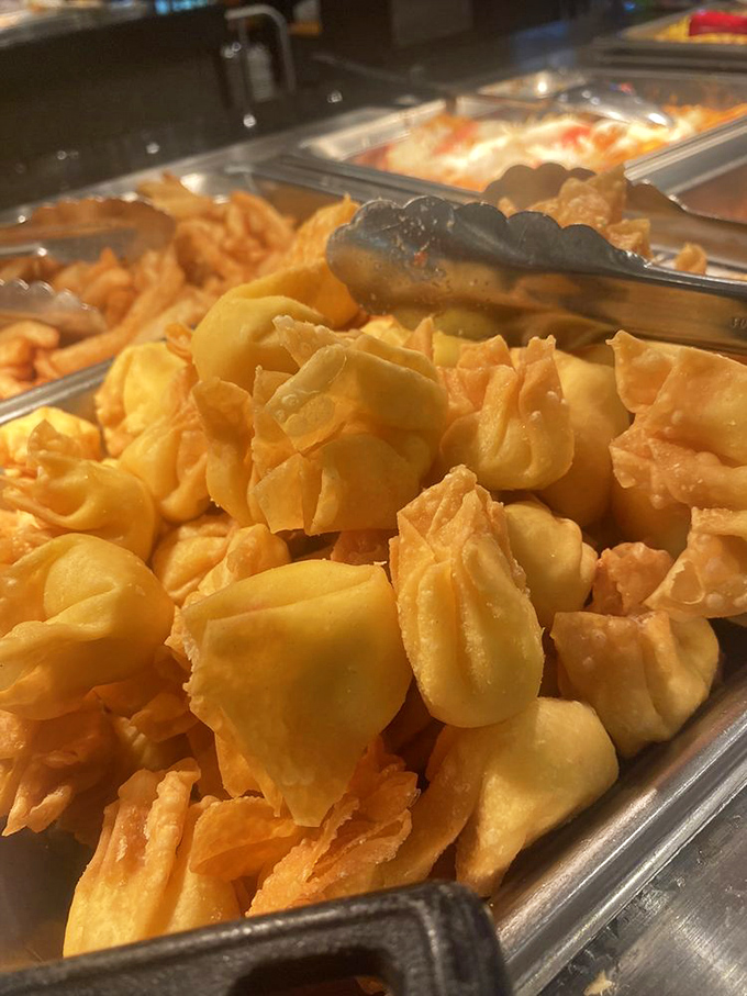 Golden crab rangoon treasures await their destiny. Like potato chips, the "just one more" phenomenon is scientifically impossible to resist.