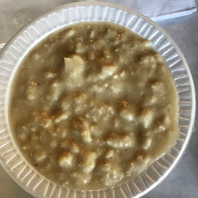 A bowl of crab bisque that looks humble but tastes like it should be served in a crystal tureen. Comfort in a styrofoam bowl.