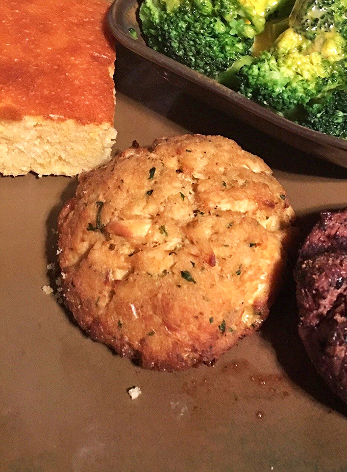 This golden crab cake stands tall and proud, proving Maryland's seafood reputation travels well to Wild West territory.