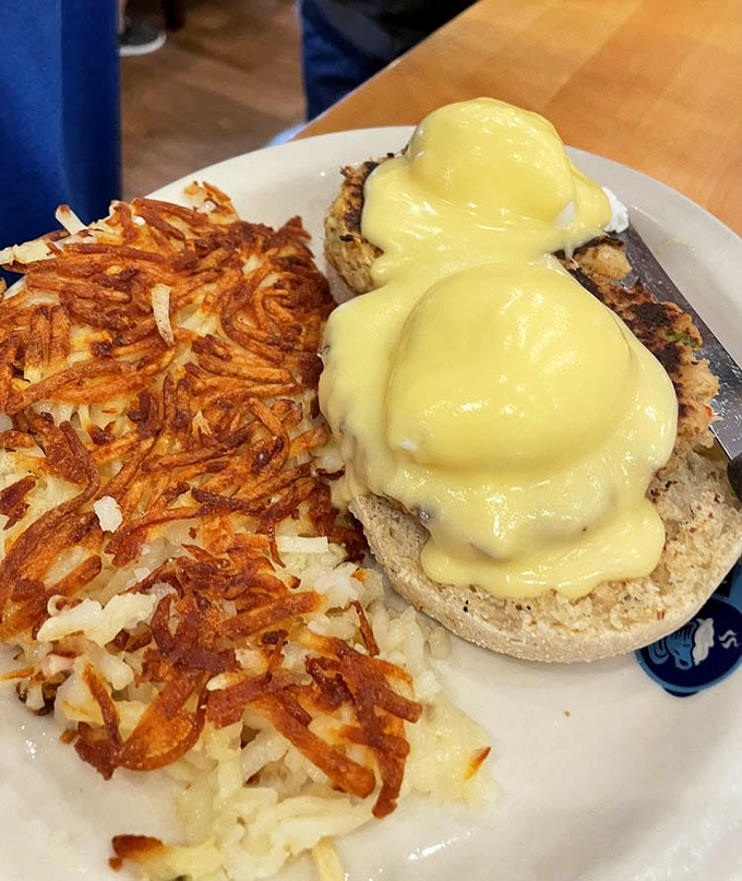 Eggs Benedict gets the coastal treatment with perfectly crispy hash browns that deserve their own fan club. That hollandaise sauce? Liquid sunshine that would make any morning better.