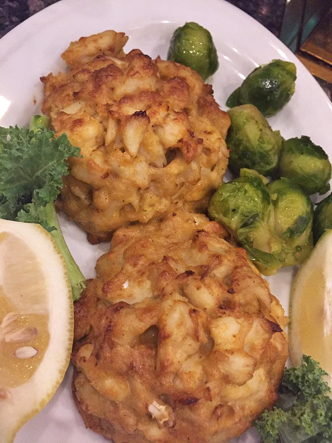 These crab cakes are what happens when someone decides that "filler" is a four-letter word. Pure Maryland blue crab, barely held together by kitchen wizardry.