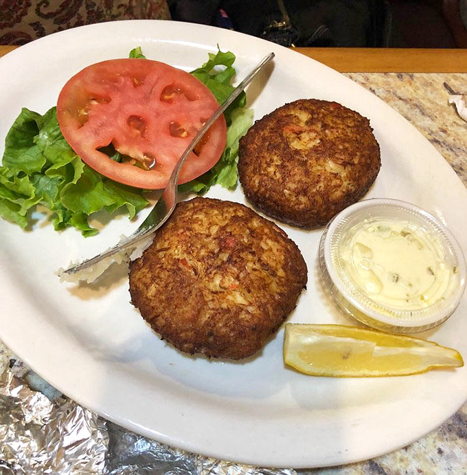 Golden-brown crab cakes that don't hide behind fillers &ndash; just pure crabby goodness with a side of "yes, this is why you came here."