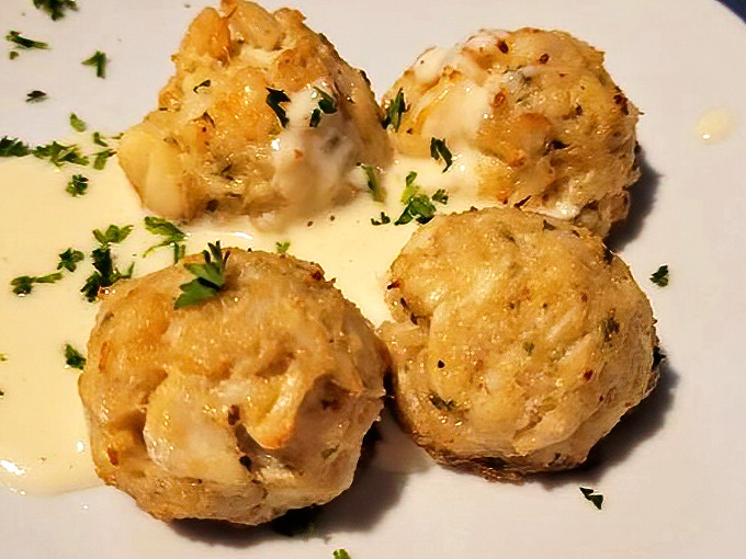 Golden crab cakes that look like they could float away on clouds of buttery, herb-flecked perfection.