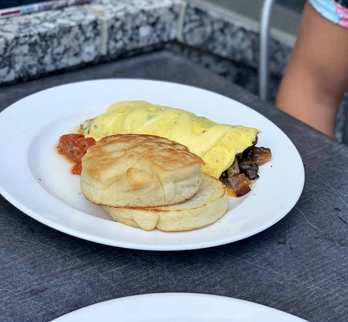 Breakfast of champions? This fluffy omelet stuffed with savory treasures proves that morning meals deserve the same reverence as dinner.