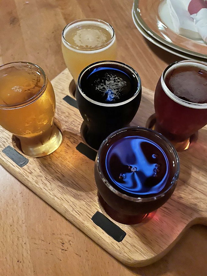 A flight of craft beers served on a wooden board &ndash; because proper barbecue deserves proper beverages to wash it down.