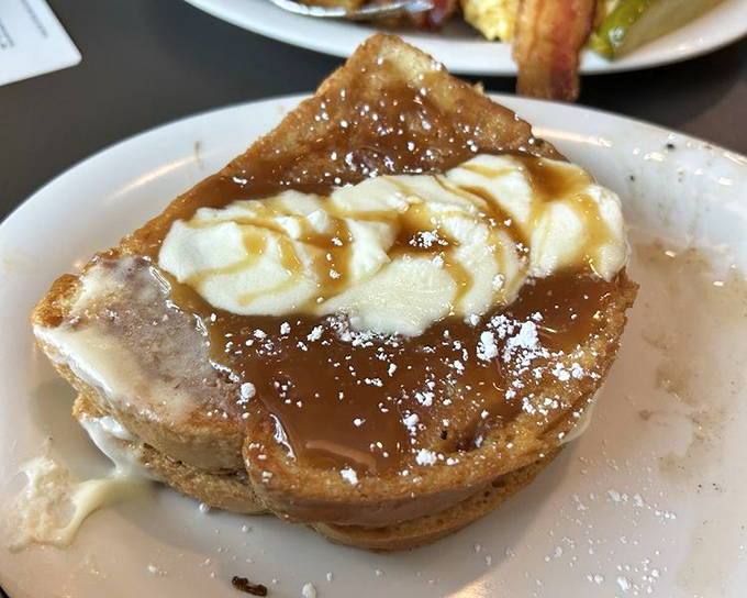 Not just French toast—it's French toast that went to finishing school. That melting ice cream and caramel drizzle would make even Marie Antoinette say, "Forget cake!"