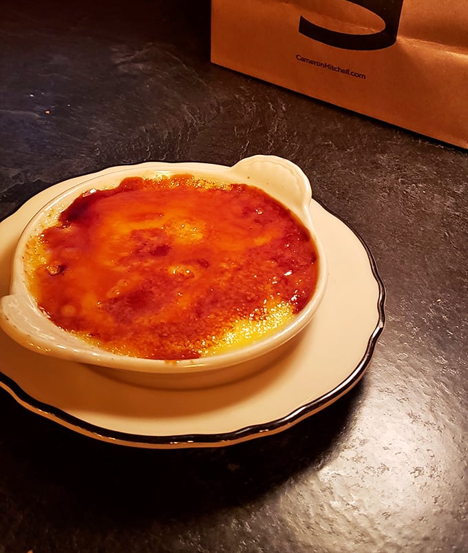 Crème brûlée with a crackling caramelized top that shatters with satisfying drama—dessert theater at its most delicious.