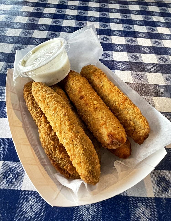 Cornmeal-crusted pickle spears that somehow manage to stay crispy while delivering that perfect briny punch. The ranch dipping sauce is merely a formality.